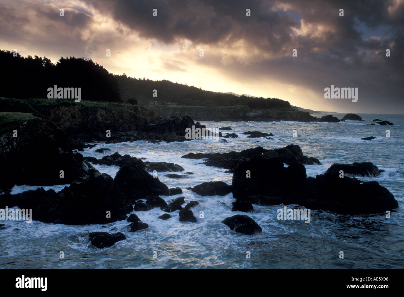 Storm clouds at sunrise over coastal cliffs and bluffs Stillwater Cove ...