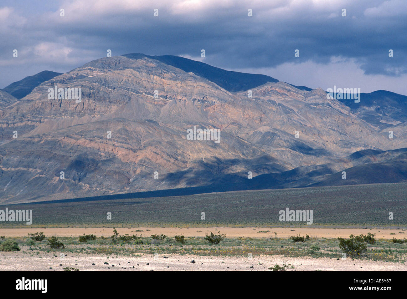 Uplift banded rock layers in mountain above alluvial fan Panamint ...