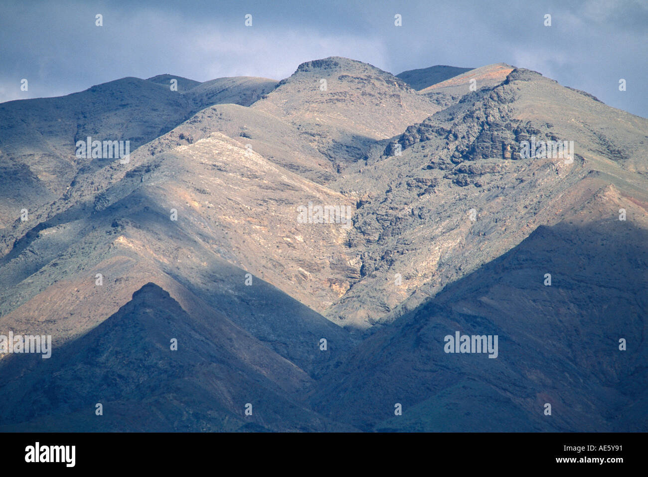 Sunlight and shadow on eroded hillside near Pinto Peak mountain Death ...