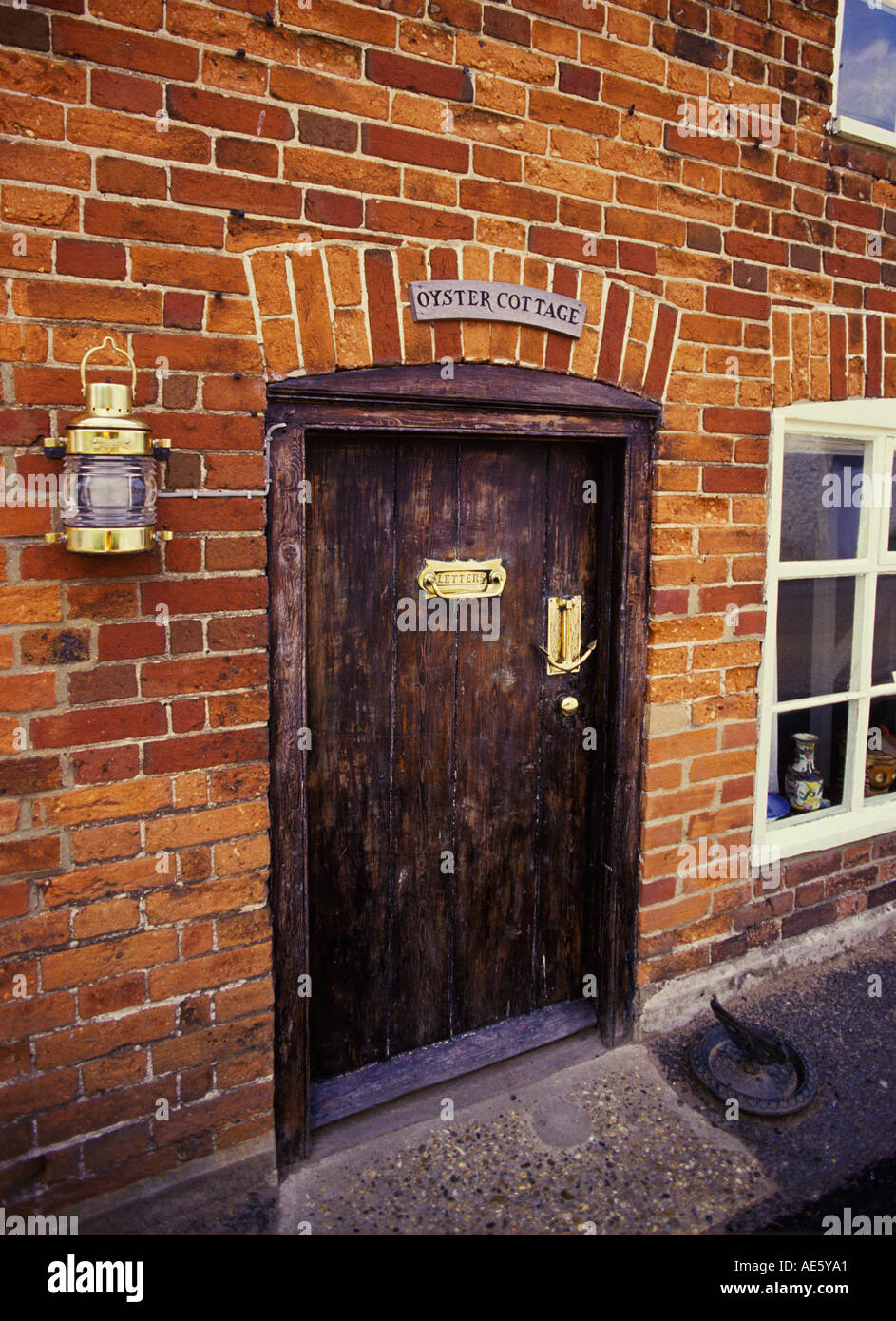 small brick terrace house Oyster Cottage has a door just over 5 ft tall ...
