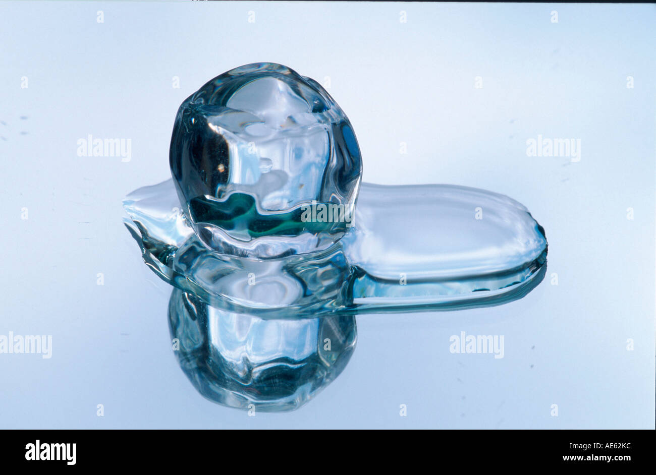Melting ice cube Stock Photo - Alamy