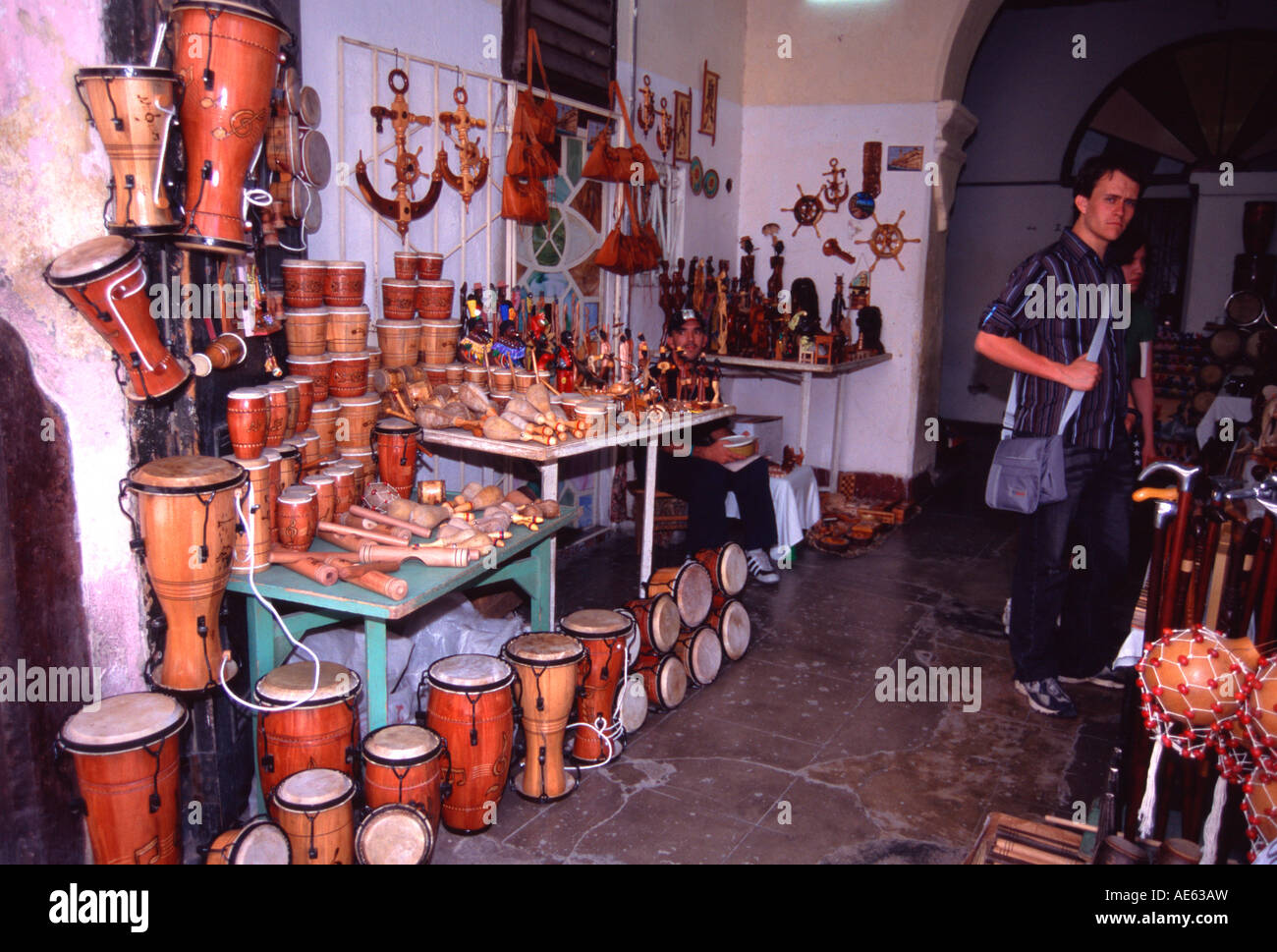 Foreing turists buying hand crafted musical instruments in Havana Cuba ...