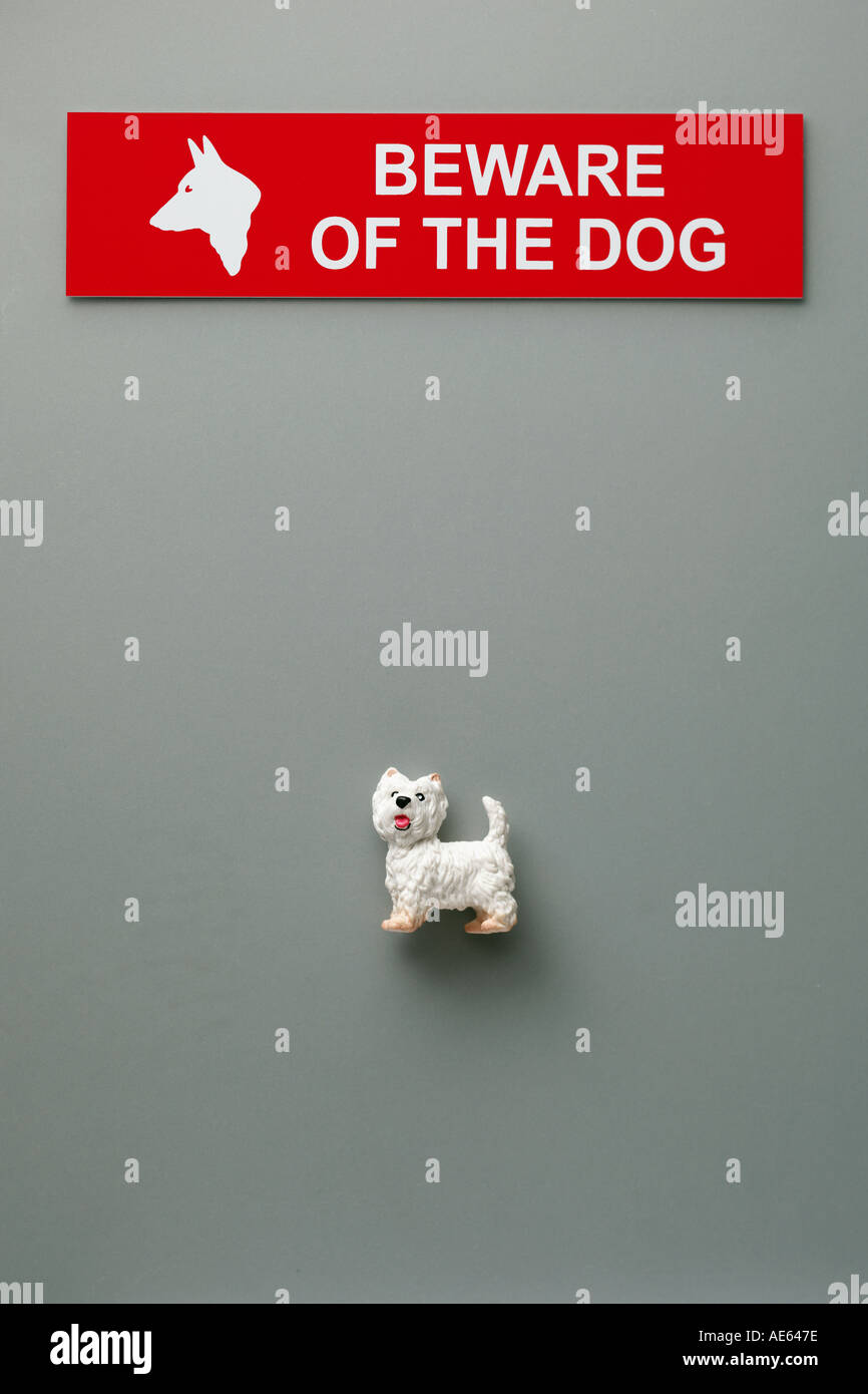 Beware of the dog featuring red beware of the dog sign Stock Photo - Alamy