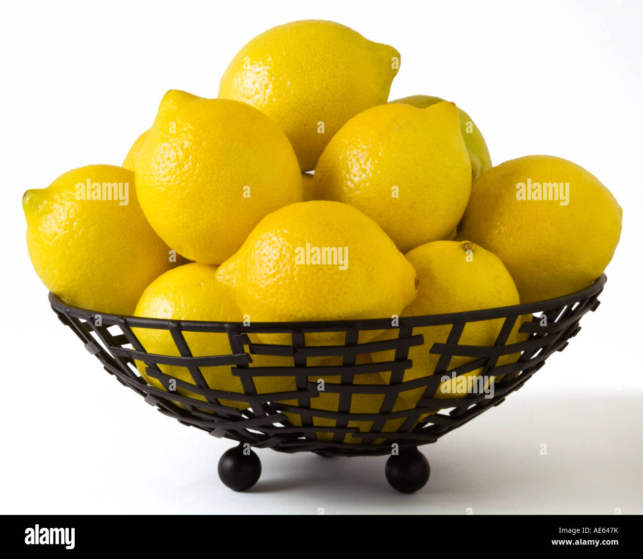 Lemons in Black wire basket Stock Photo - Alamy