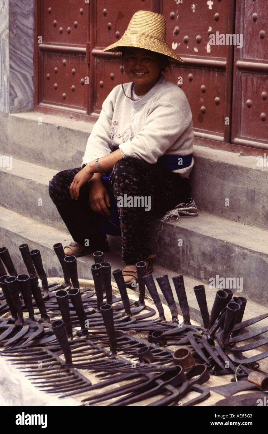 China Yunnan Wase Near Dali A lady sells farming tools at market Stock ...