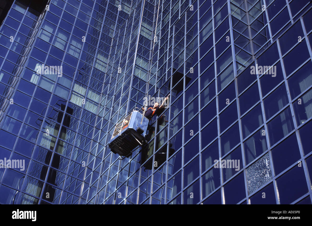 Reach and wash window cleaner hi-res stock photography and images - Alamy
