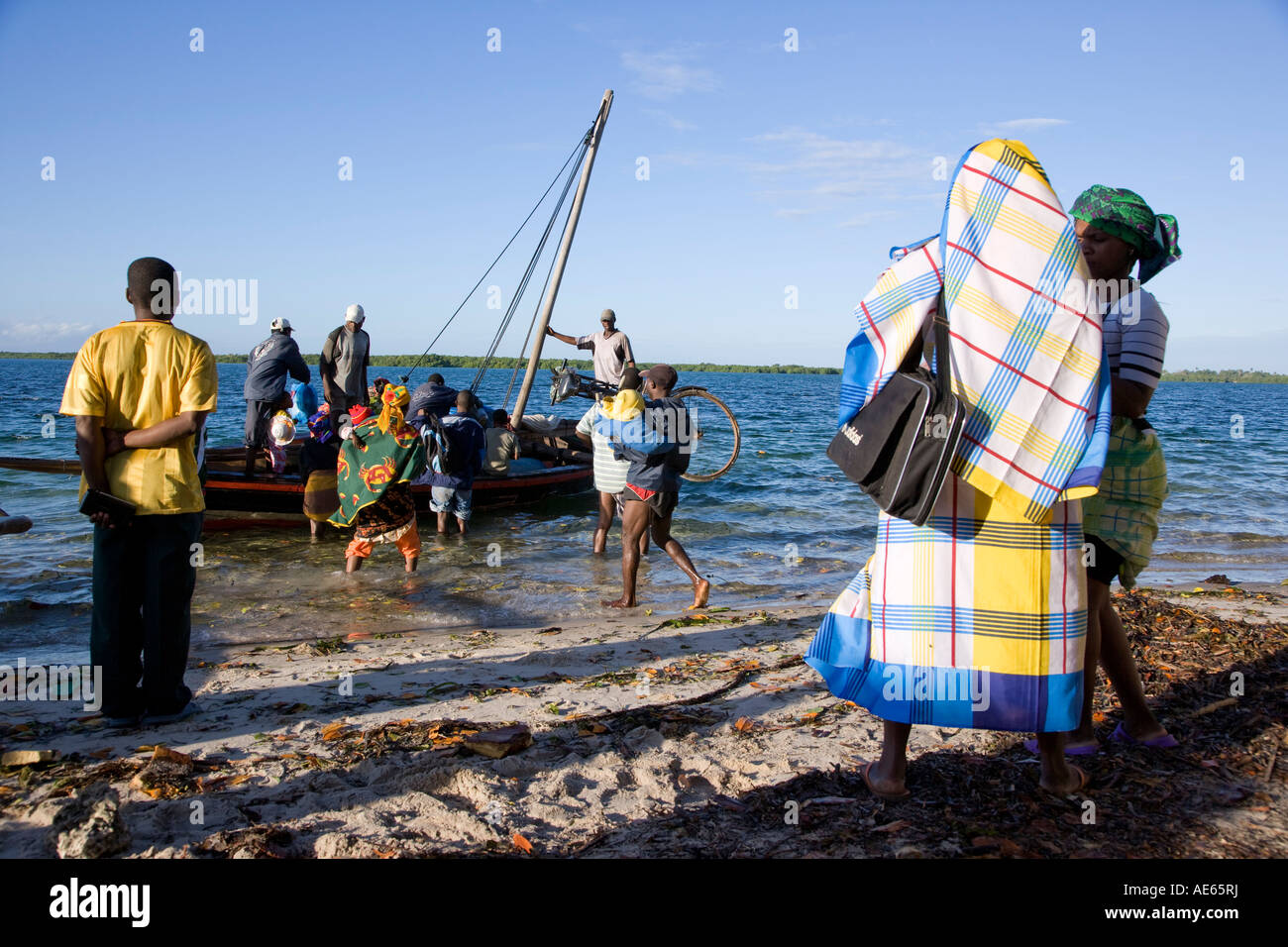 Loading a dhow in the harbout of Ibo Island part of the Quirimbas ...