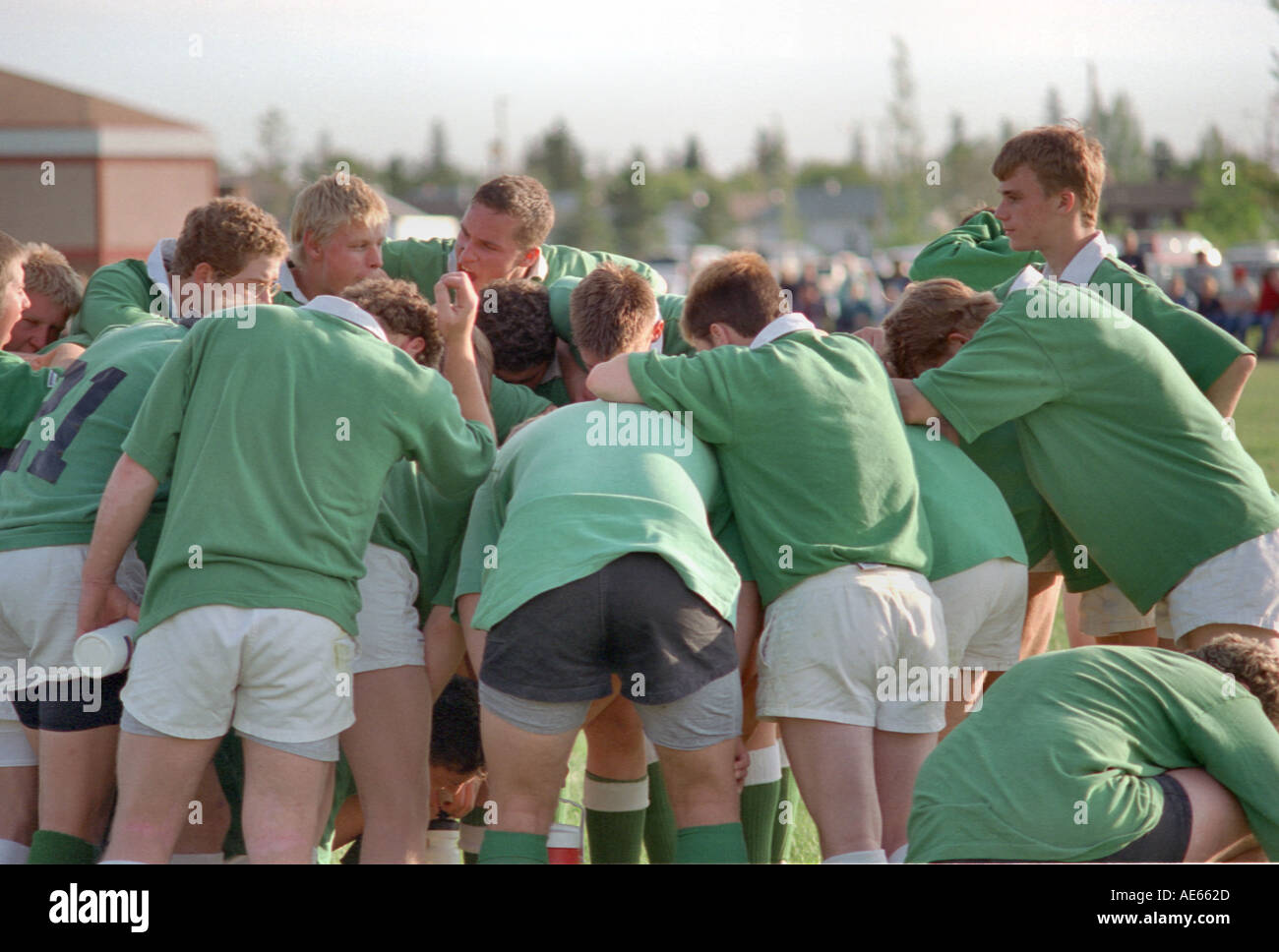 Rugby players huddle Stock Photo - Alamy