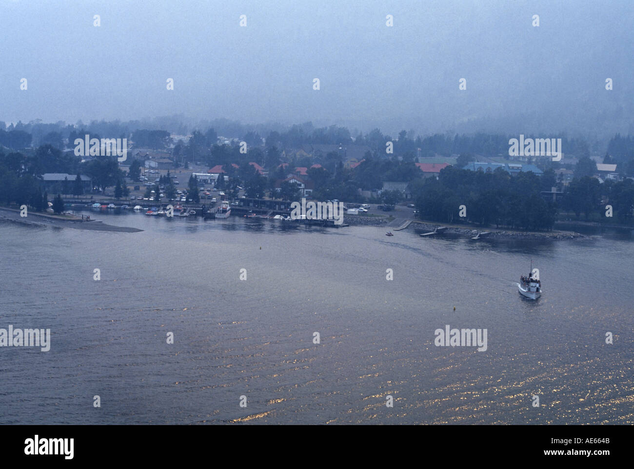 Tour boat leaving dock Stock Photo - Alamy