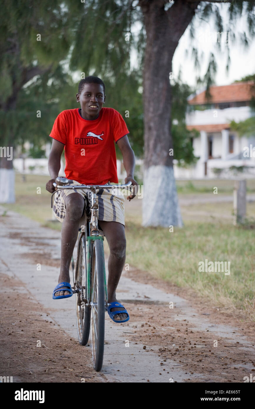 A boy riding his bicycle on Ibo Island part of the Quirimbas Archipelago Mozambique Stock Photo ...