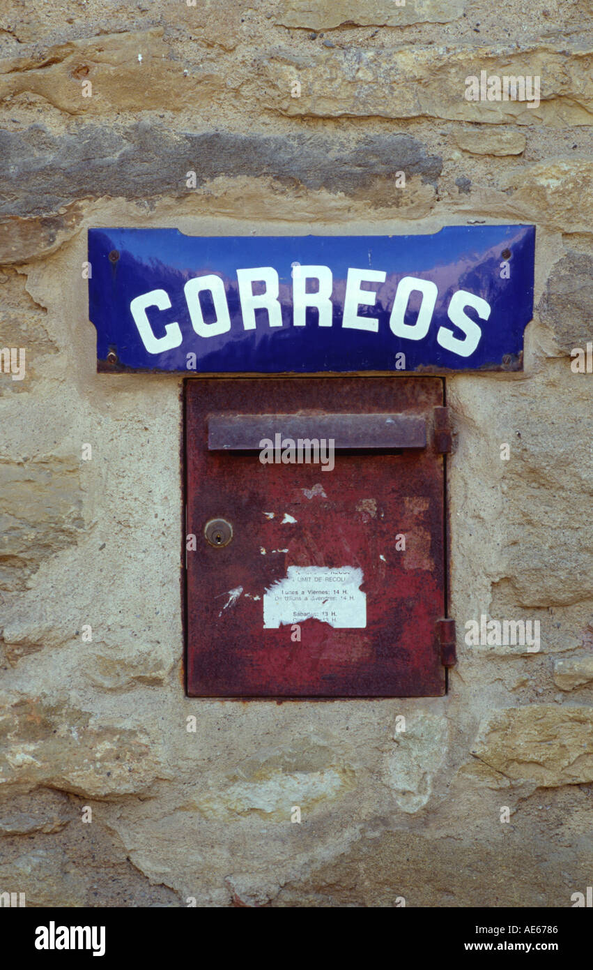 old rusted spanish letter box post box correos in stone wall Stock ...
