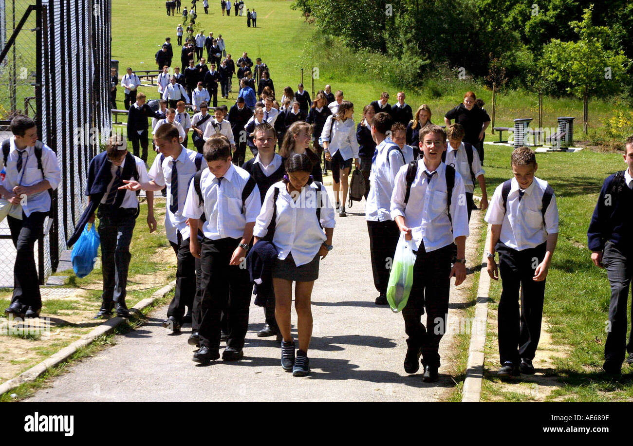 Secondary school children walking in park Stock Photo - Alamy