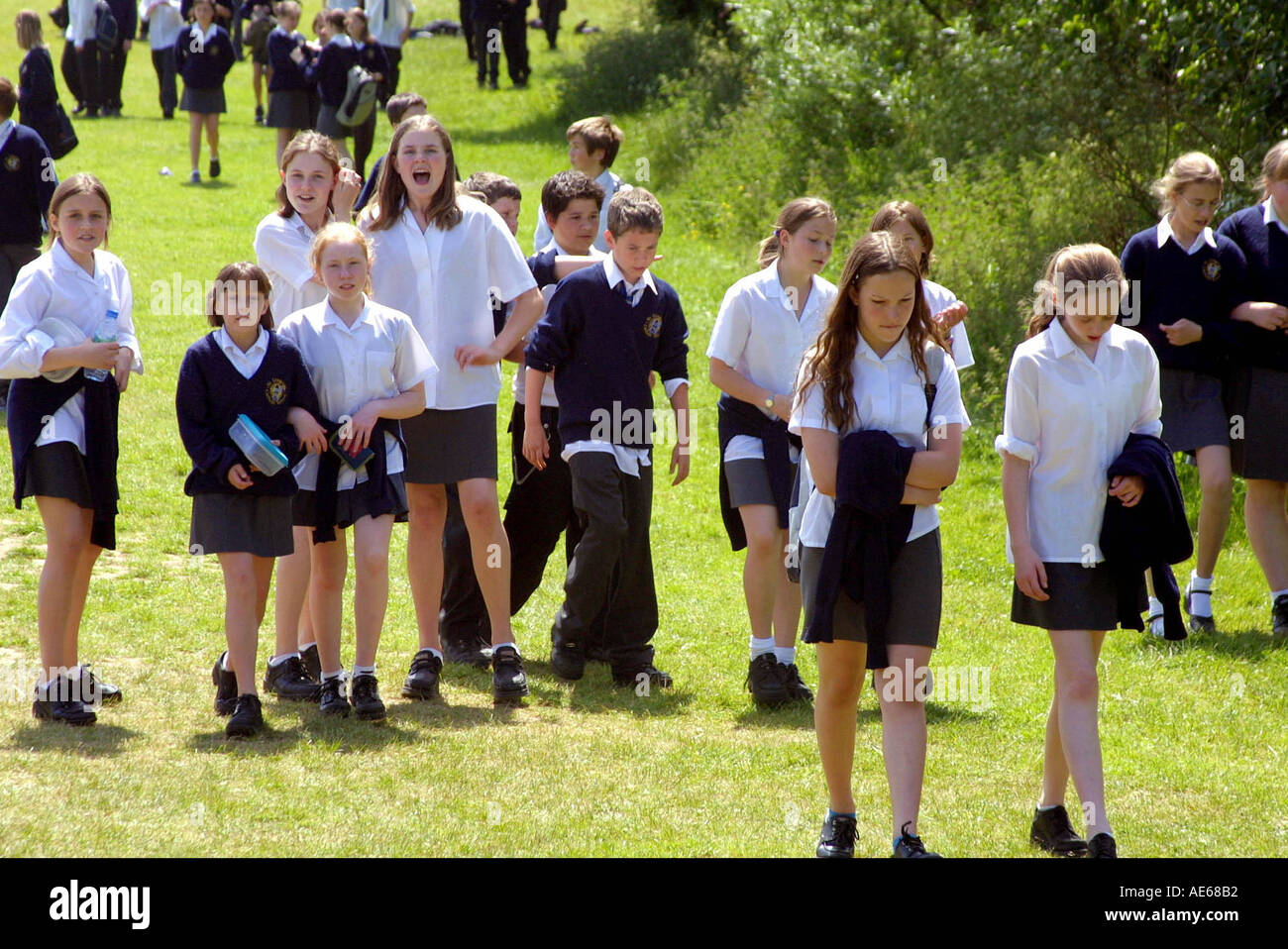 Secondary school children walking in the park Stock Photo - Alamy
