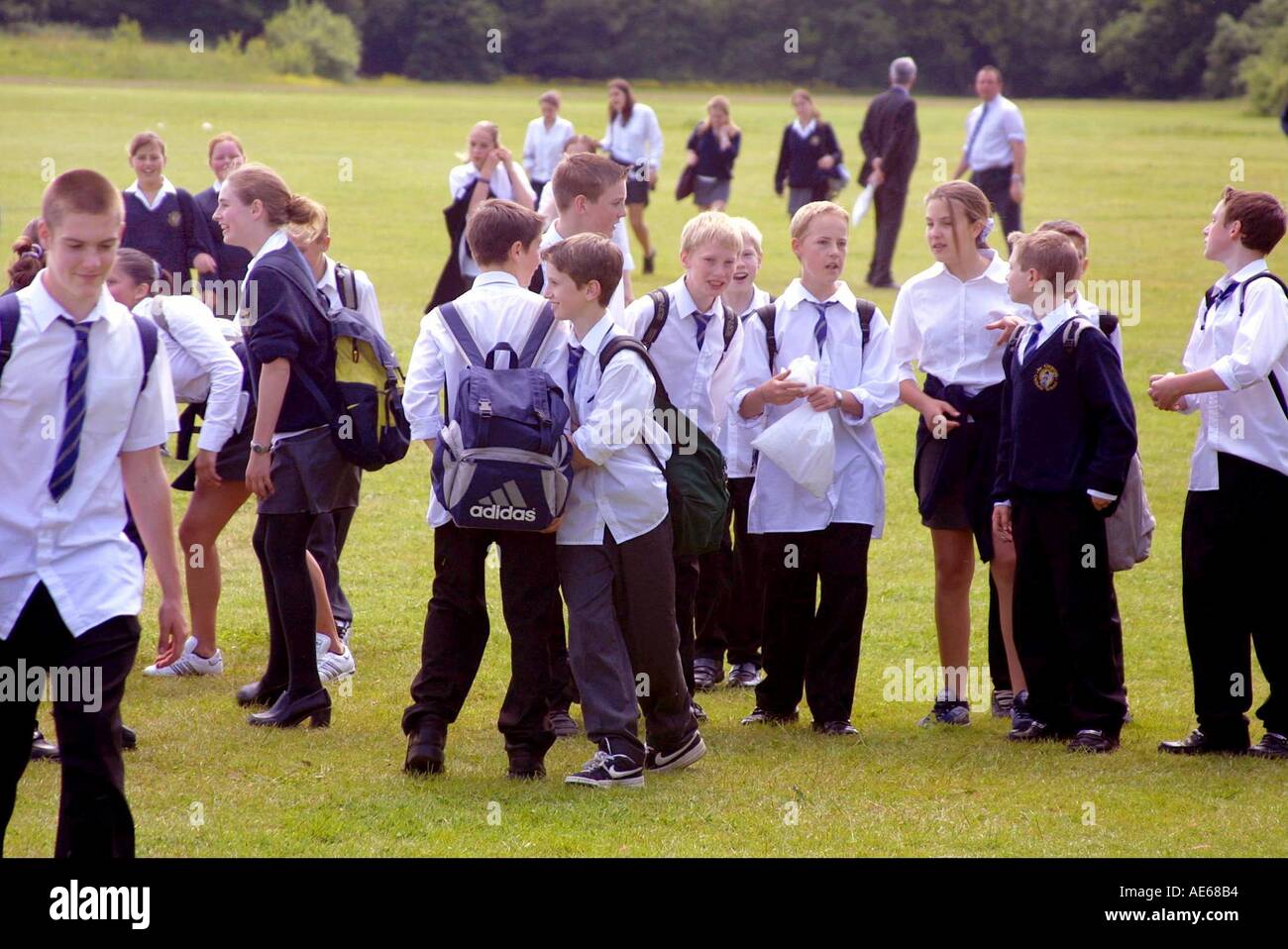 Secondary school children walking in the park Stock Photo - Alamy