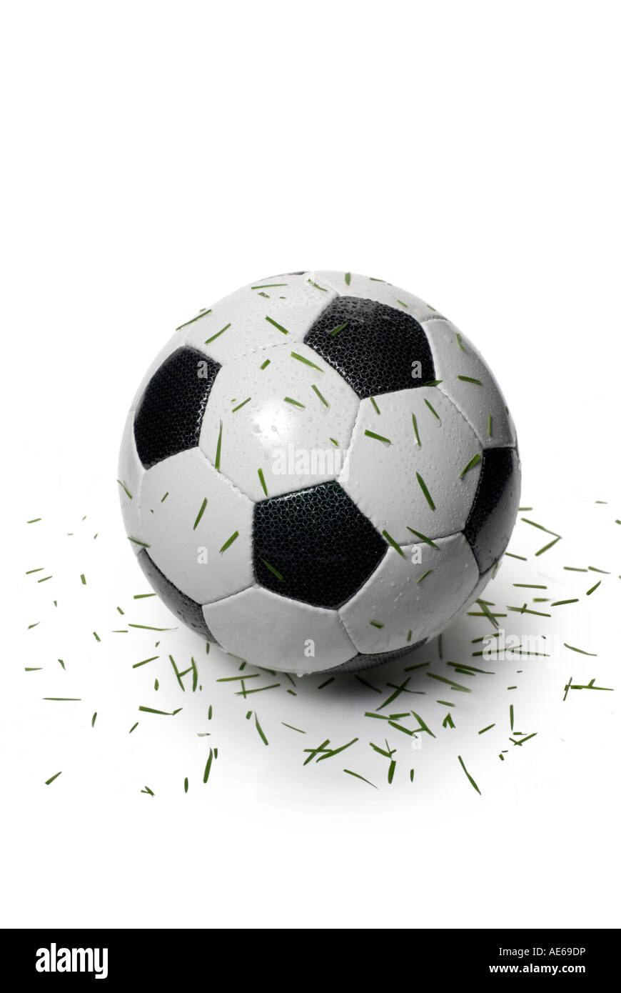 soccer ball with wet grass on white background Stock Photo - Alamy