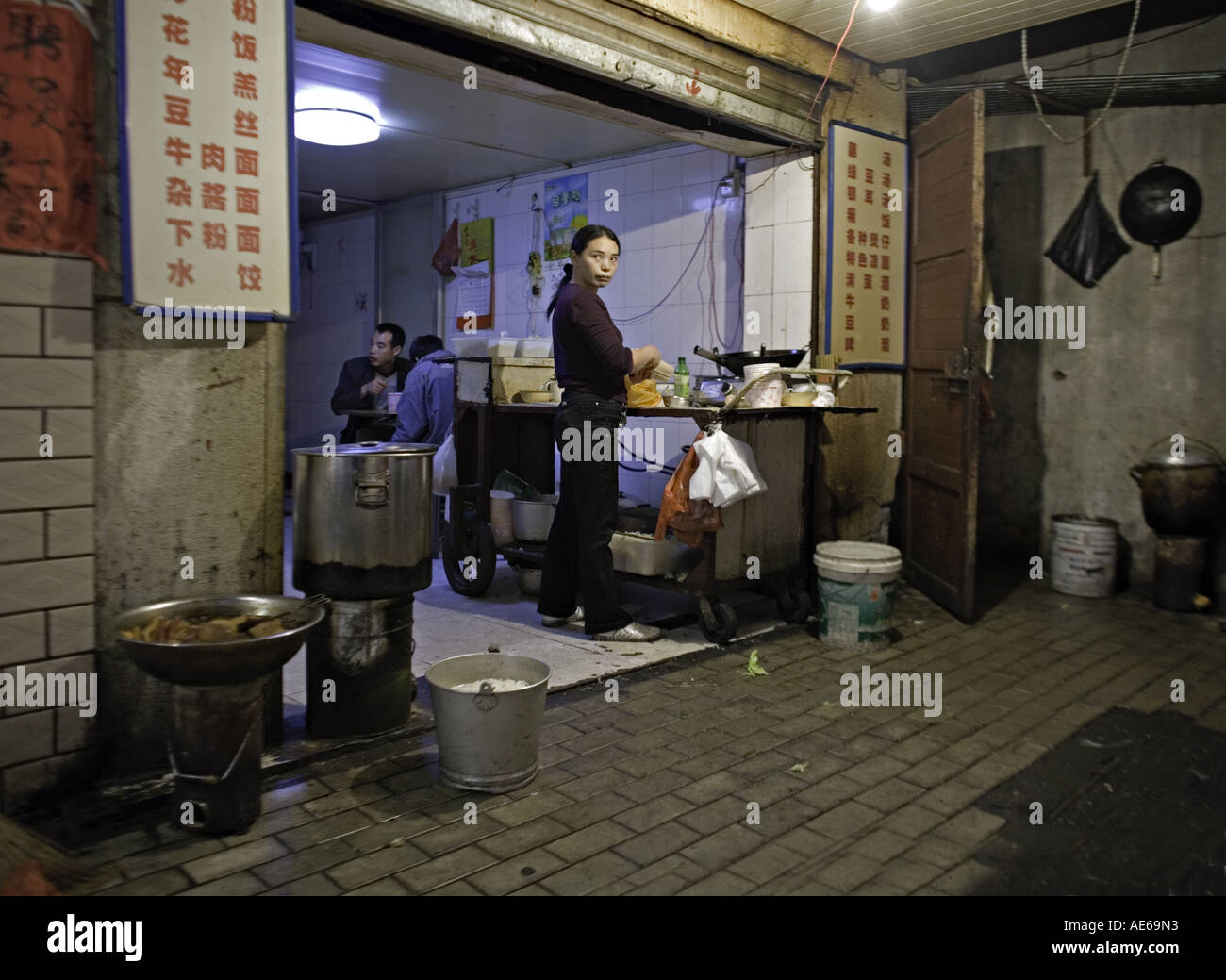 CHINA WUHAN Night street scene outside tiny but busy neighborhood ...