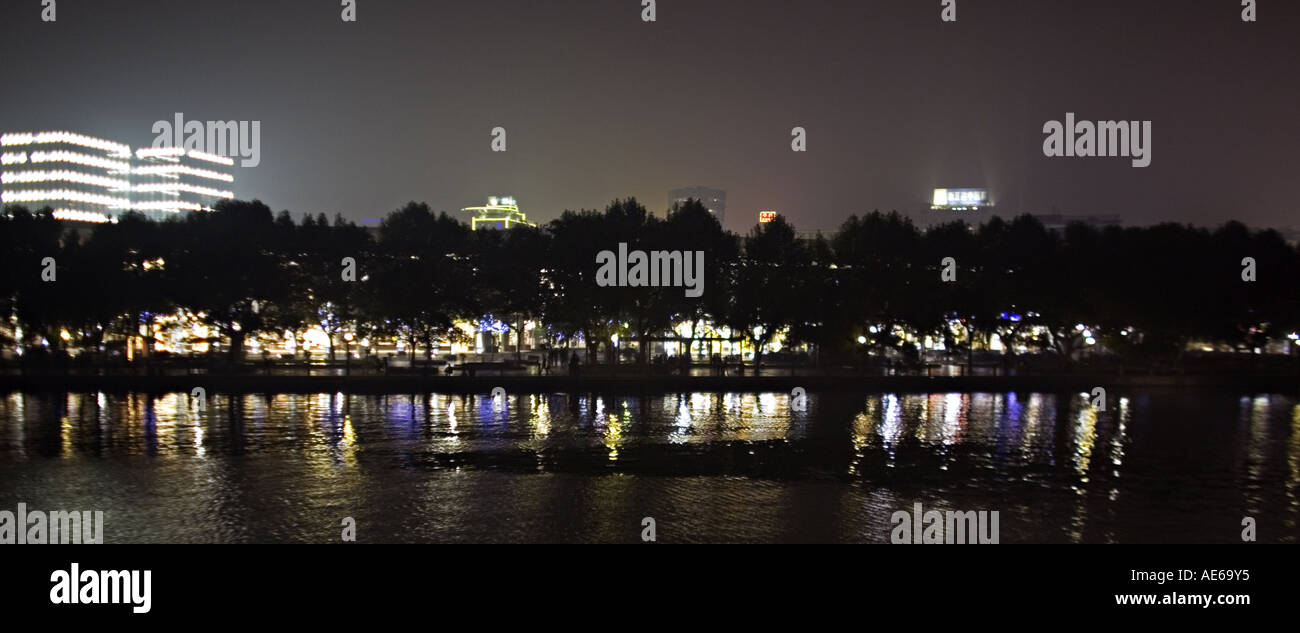 CHINA HANGZHOU Citizens of Hangzhou walking under willow trees on the ...