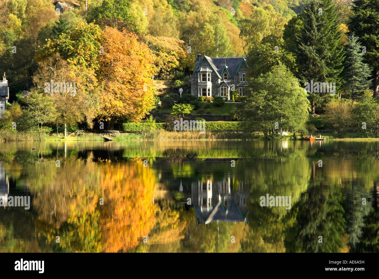 Autumn reflection at Little Loch Ard Stock Photo - Alamy
