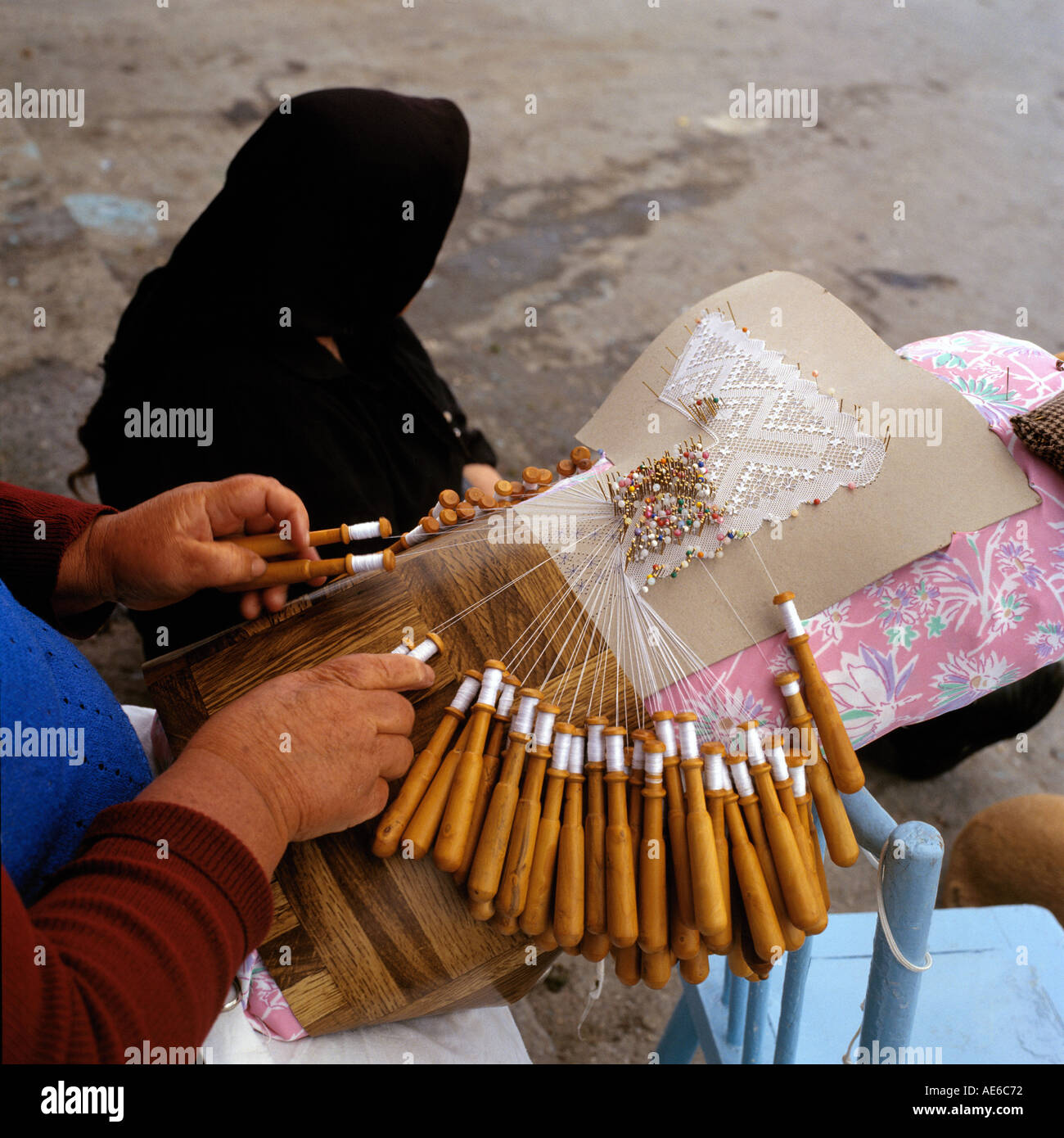 Mid section view of person's hand making lace, Camarinas, Galicia ...
