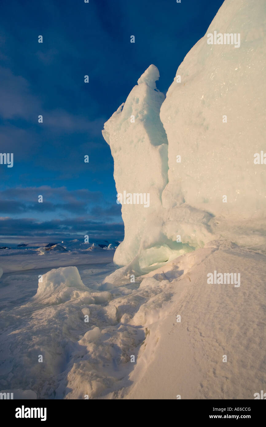 Antarctica Snow Hill Island Setting sun lights icebergs frozen into ...