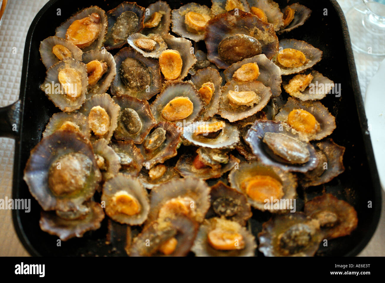 Grilled limpets are a delicacy at the Azores islands, Portugal Stock ...