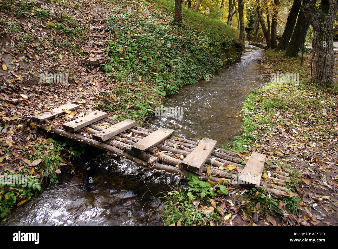 small wooden bridge over a brook Stock Photo - Alamy