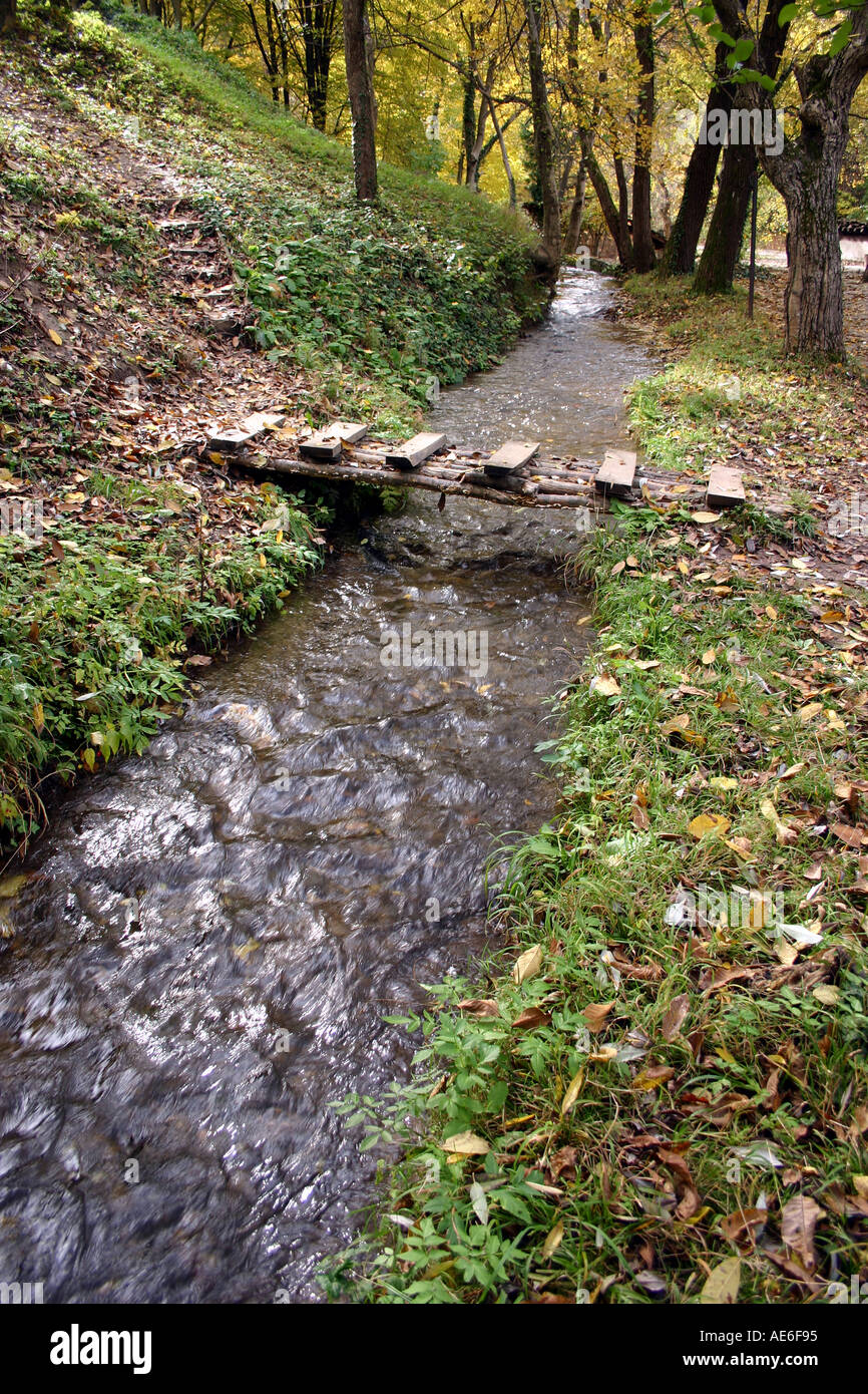 small wooden bridge over a brook Stock Photo - Alamy