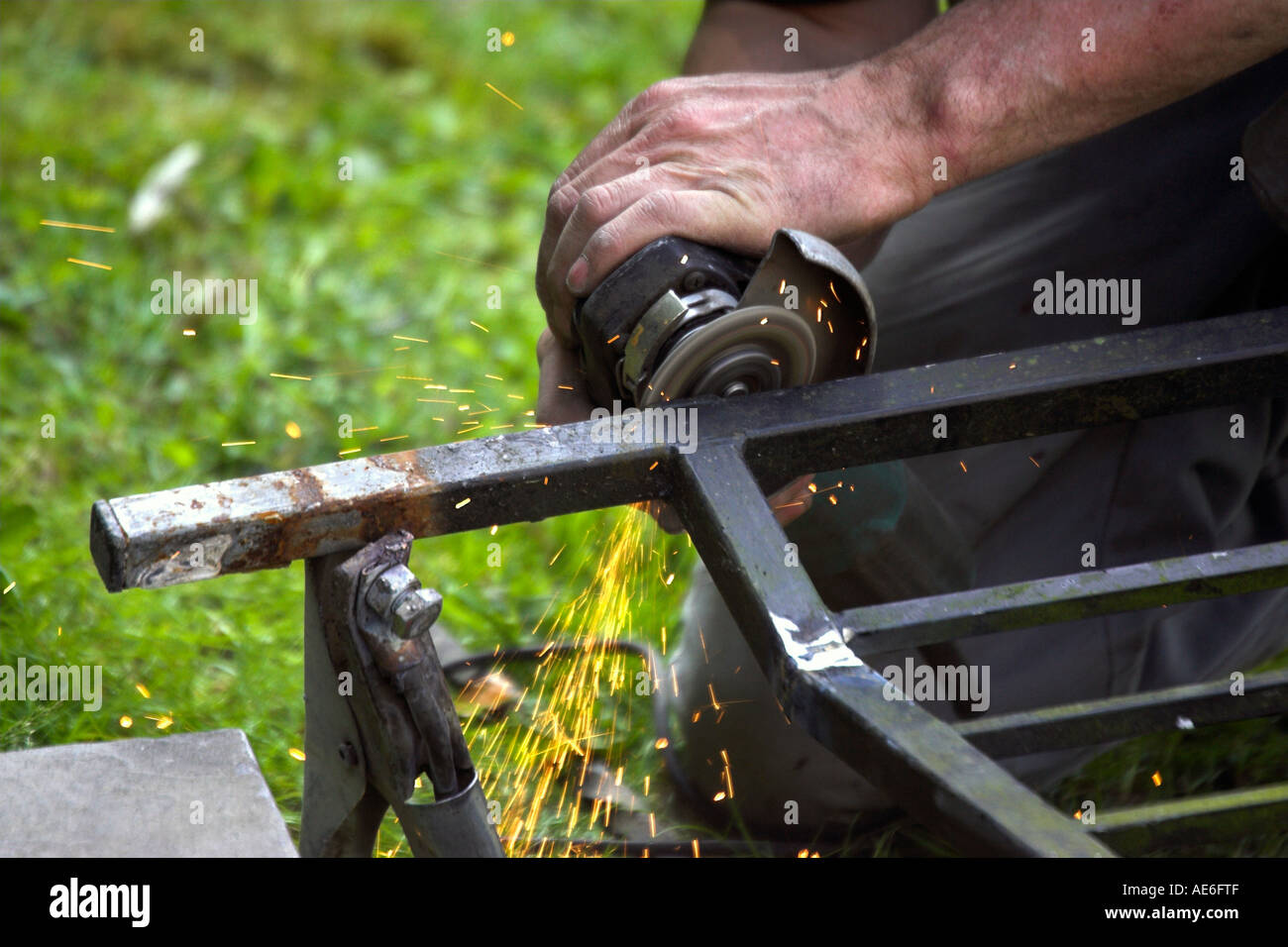 blacksmith welding wrought iron work Stock Photo - Alamy