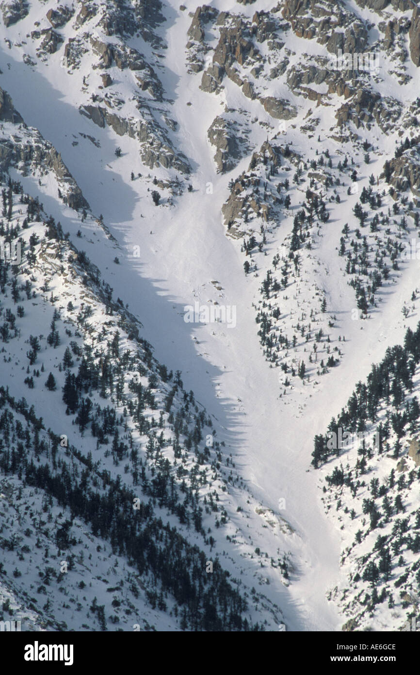 Avalanche chute snow gully on mountain in winter near Lone Pine Eastern ...