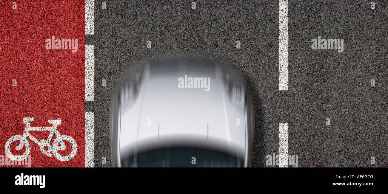 Moving car next to cycle lane Stock Photo - Alamy