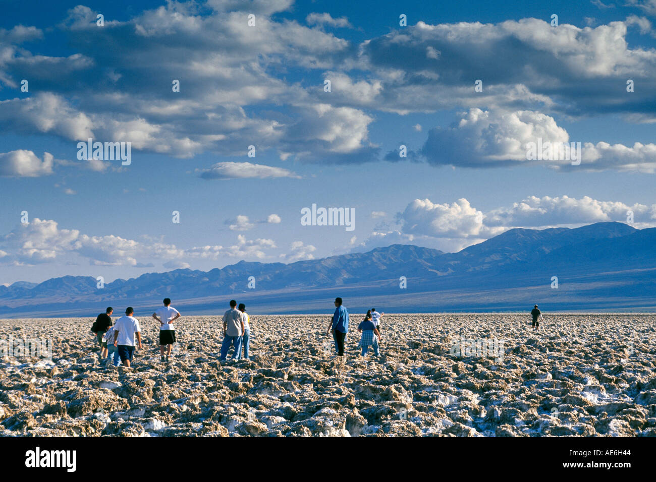Tourists walking on salt encrusted rocks at Devlis Golf Course Death ...