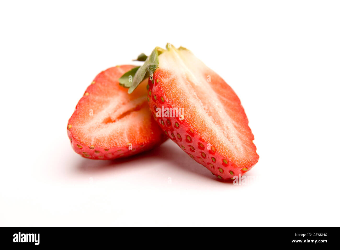 Single strawberry cut in half Stock Photo - Alamy