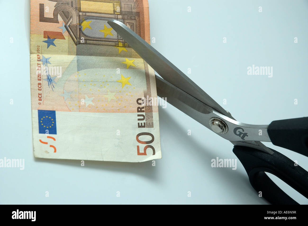 a banknote cutting by scissors Stock Photo - Alamy