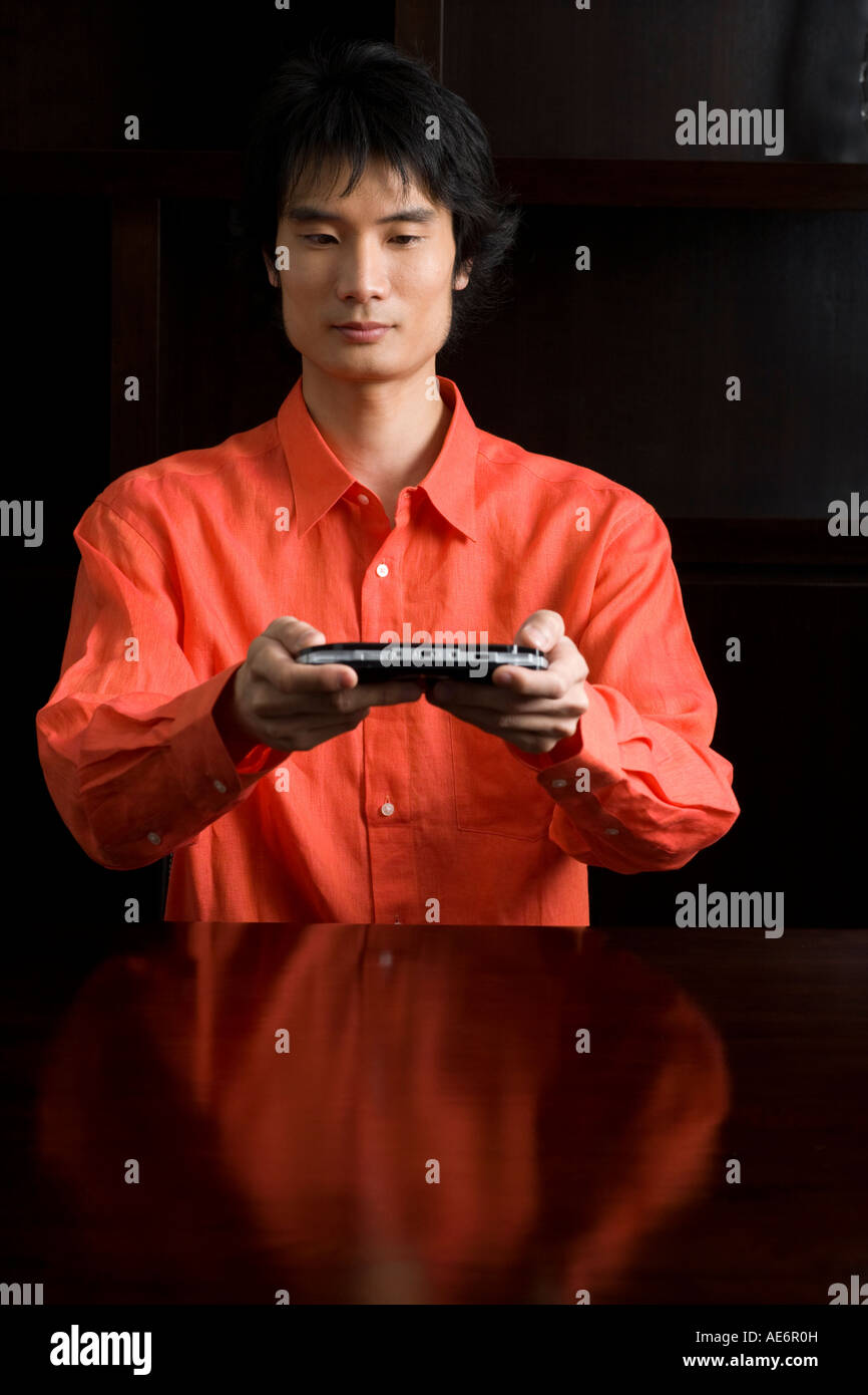 man plays with video game consul Stock Photo - Alamy