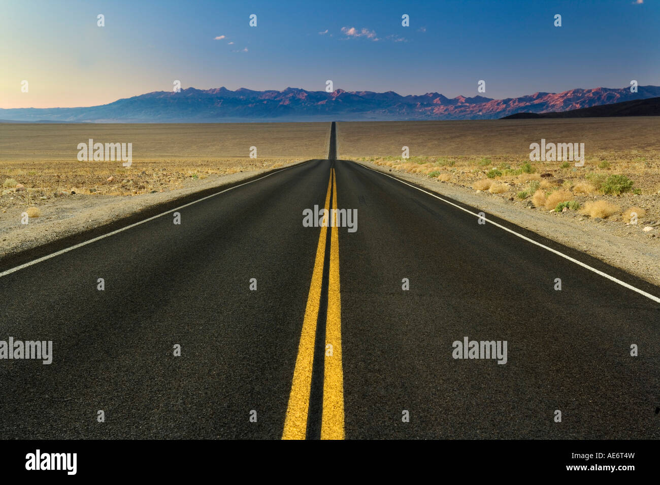 Long Road in Death Valley Stock Photo - Alamy
