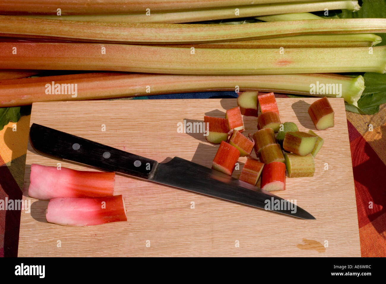 Cut rhubarb on chopping board Stock Photo - Alamy