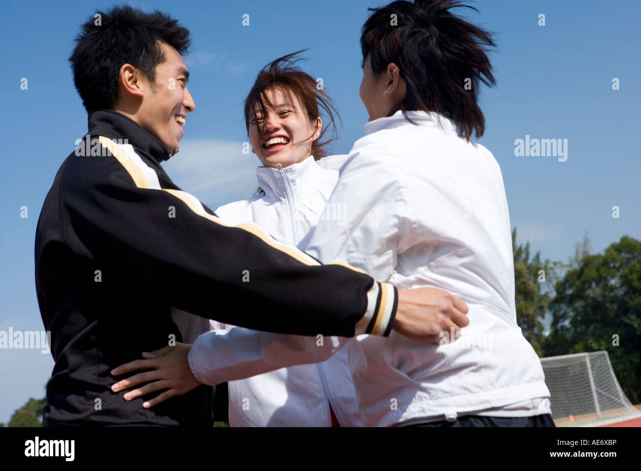 athletes celebrate on the track Stock Photo - Alamy