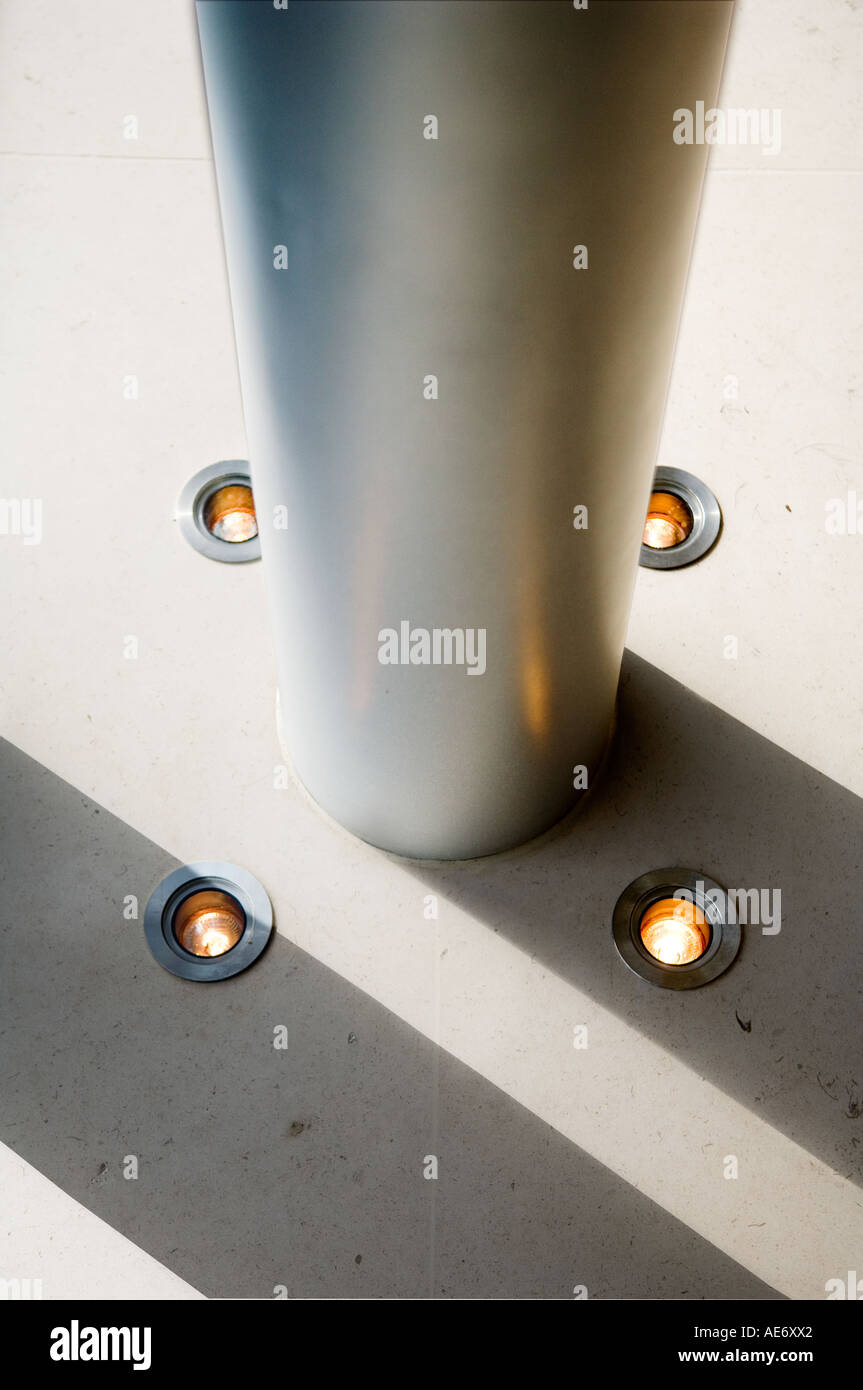 Floor up-lighters by a steel column in a high-tech interior Stock Photo ...