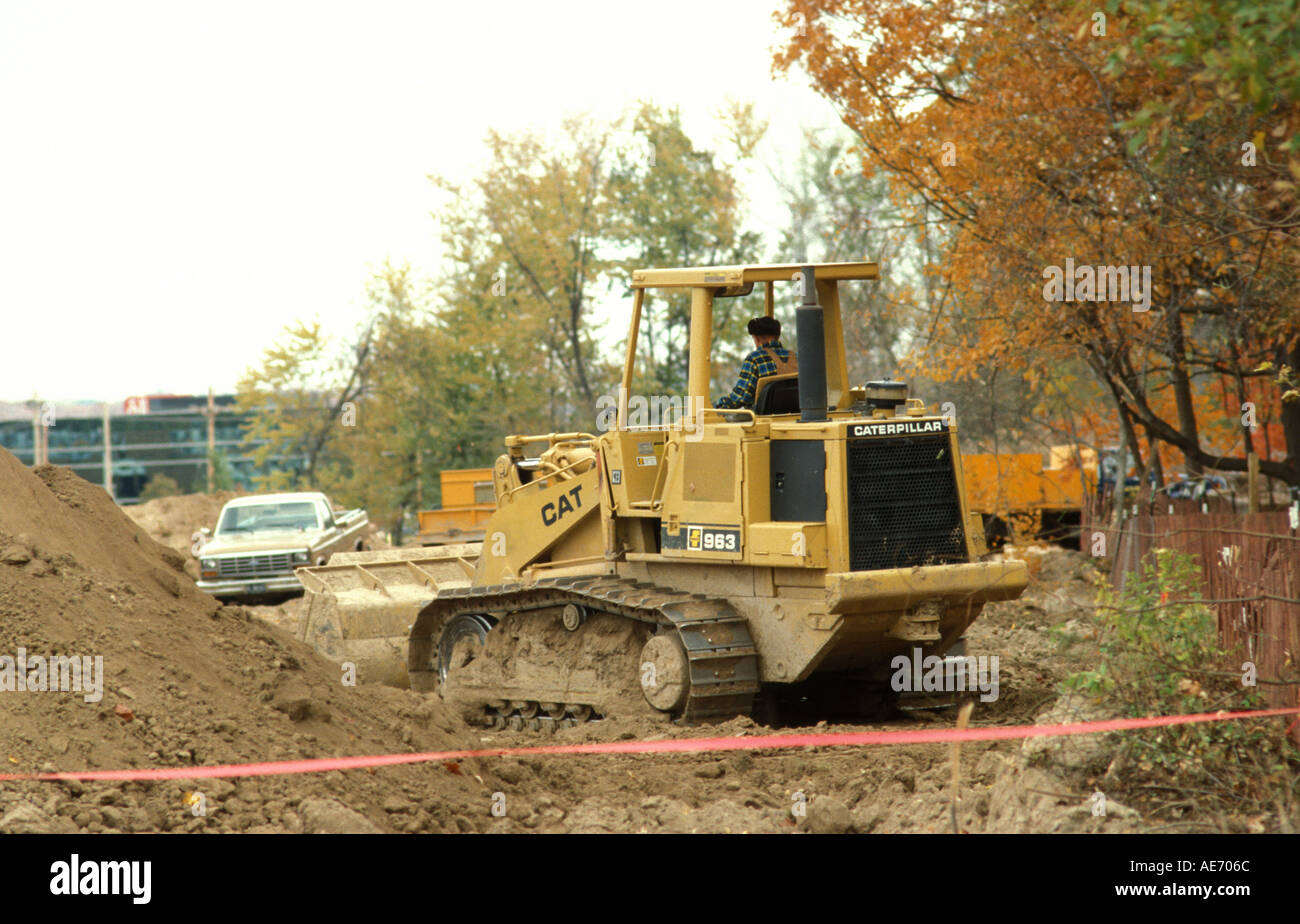 Caterpillar track loader at commercial construction site Stock Photo ...