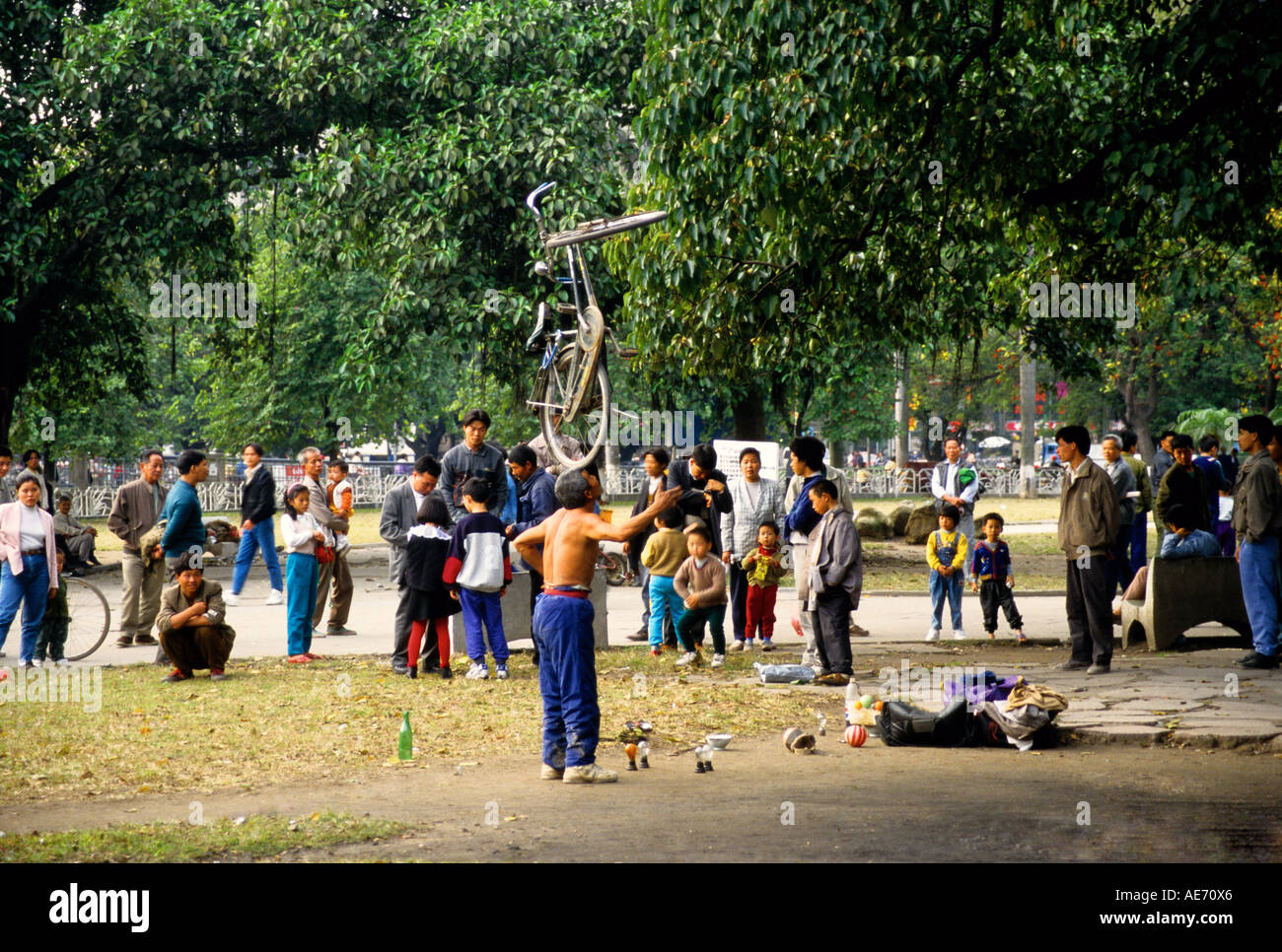 Entertainer with crowd in the park at Hai Zhu Square in Guangzhou ...