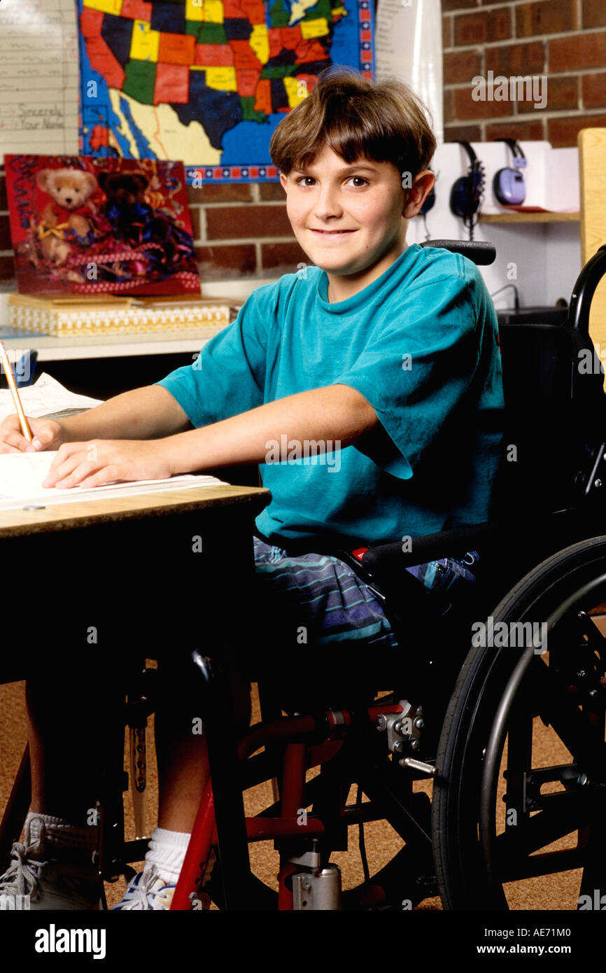 Handicapped student with energetic smile age 10 in grade 5 at desk ...