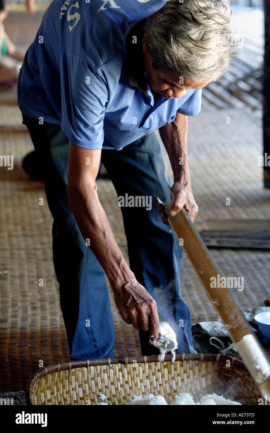 Elderly Man Scraping Roasted Glutinous Rice From Bamboo, Kamung Annah ...
