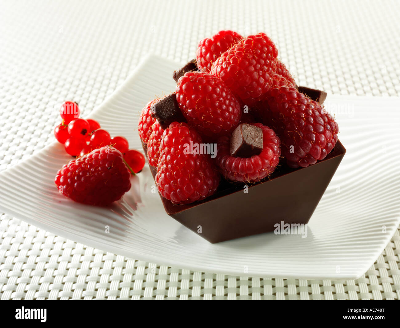 A modern square chocolate cake filled with chocolate truffle and topped ...