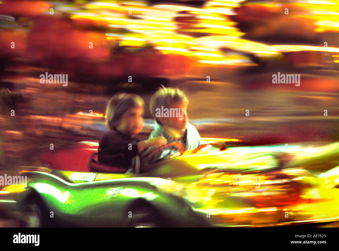 TWO CHILDREN RIDING IN TOY CAR AT AMUSEMENT PARK LOS ANGELES CALIFORNIA ...
