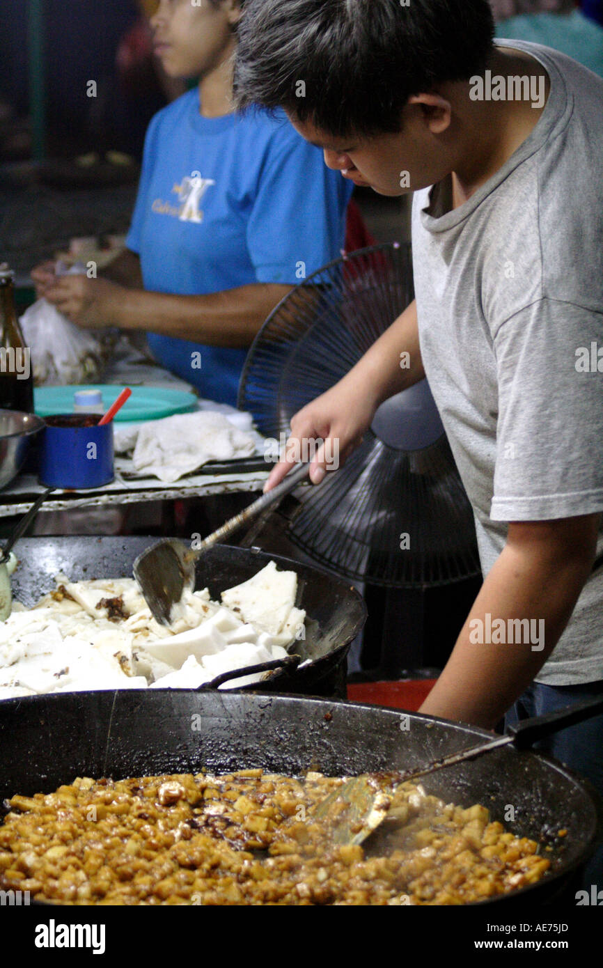 Malaysian Man in a Small Restaurant Making Traditional Local Food at ...