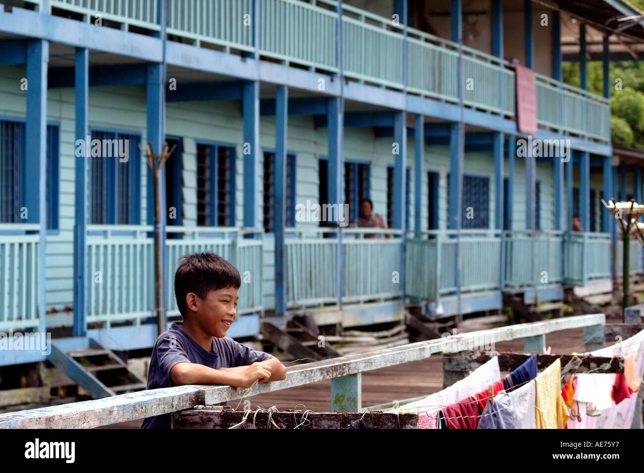 Malaysian Boy Looking Over Railing on a Section of Rumah Engking ...