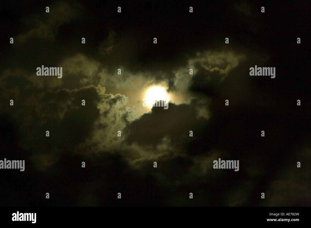 Full moon in a dark night rays it s creepy light throug the changing ...