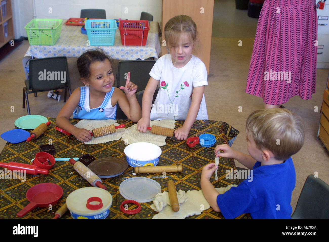 Nursery school children making pastry in class Stock Photo - Alamy