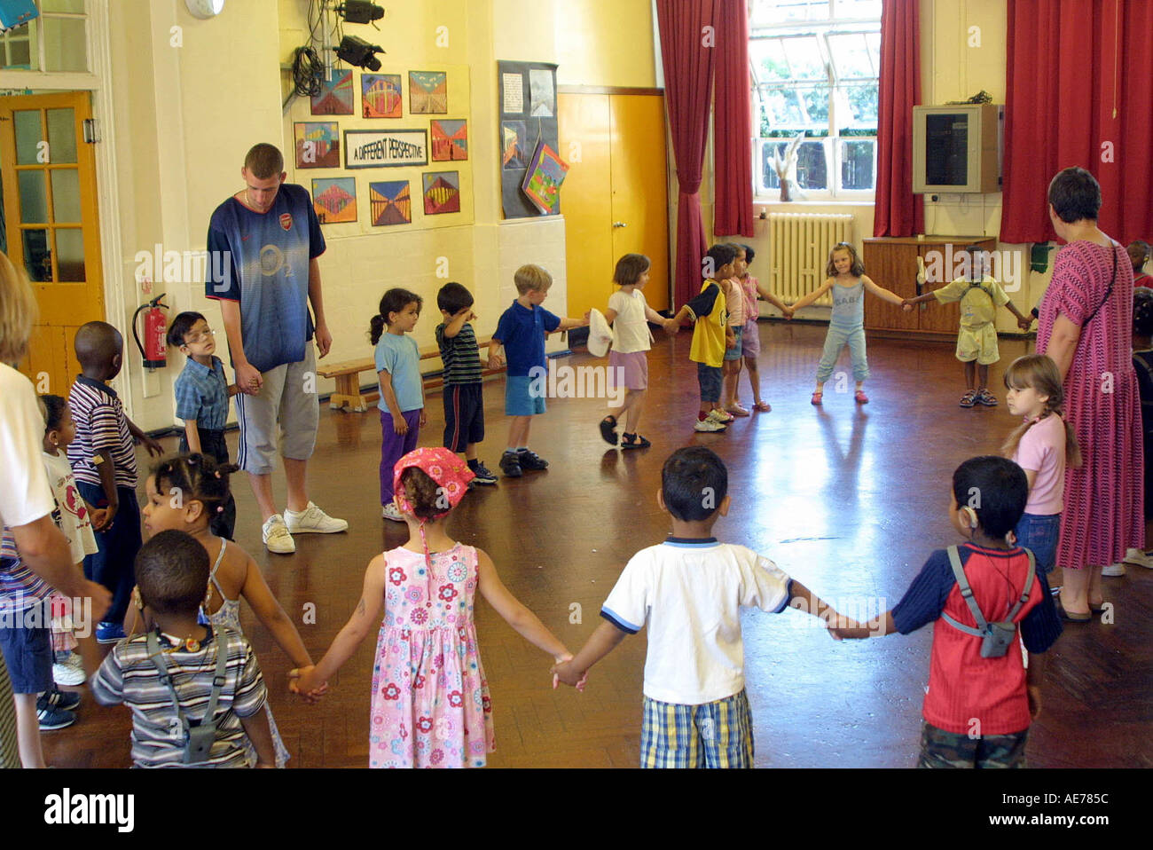 Nursery children playing game in school hall Stock Photo - Alamy