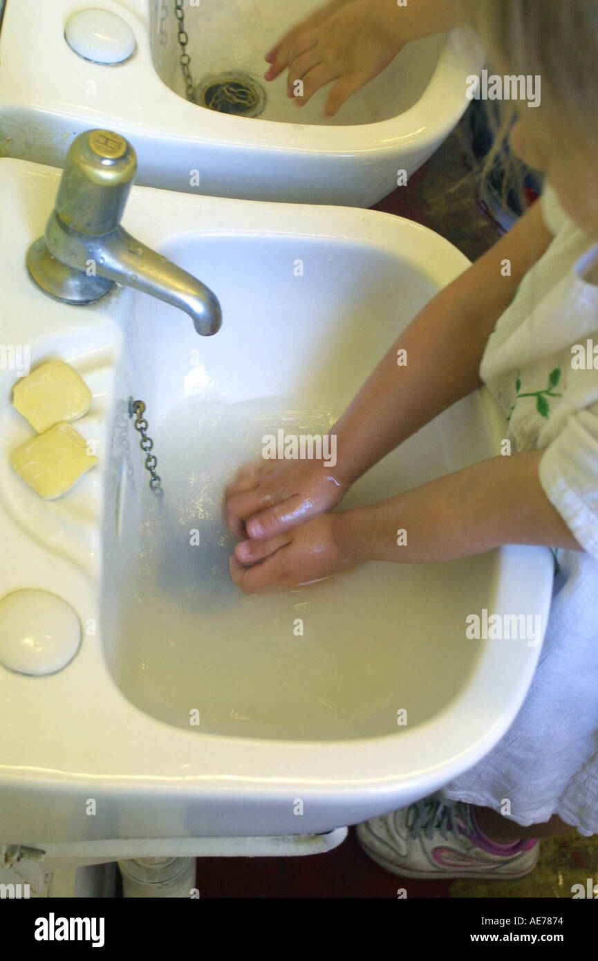 Nursery children washing hands Stock Photo - Alamy